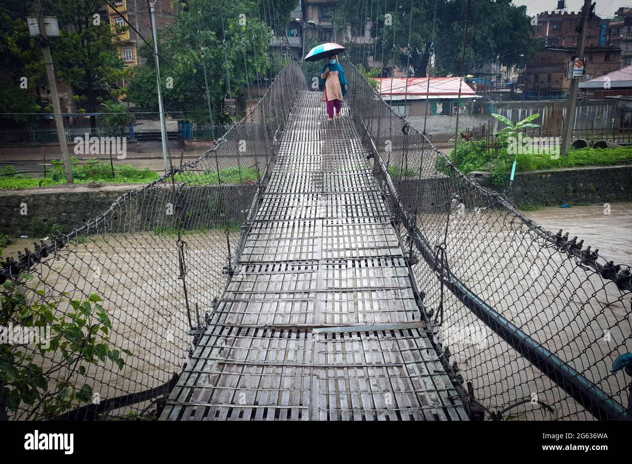Kathmandu, Bagmati, Nepal. 2nd July, 2021. A pedestrian crosses the ...