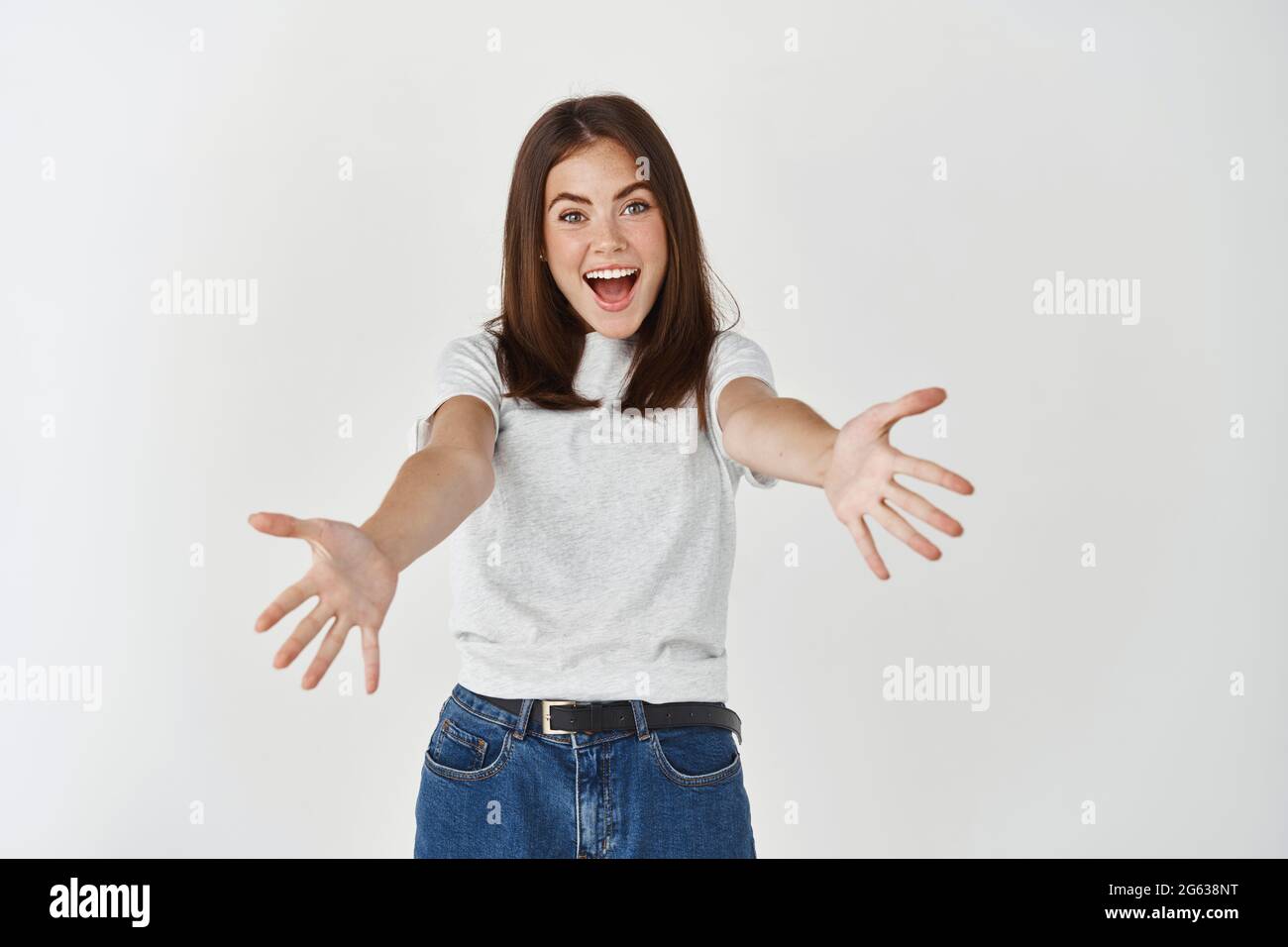 Beautiful surprised woman reaching out, stretching hands forward to ...