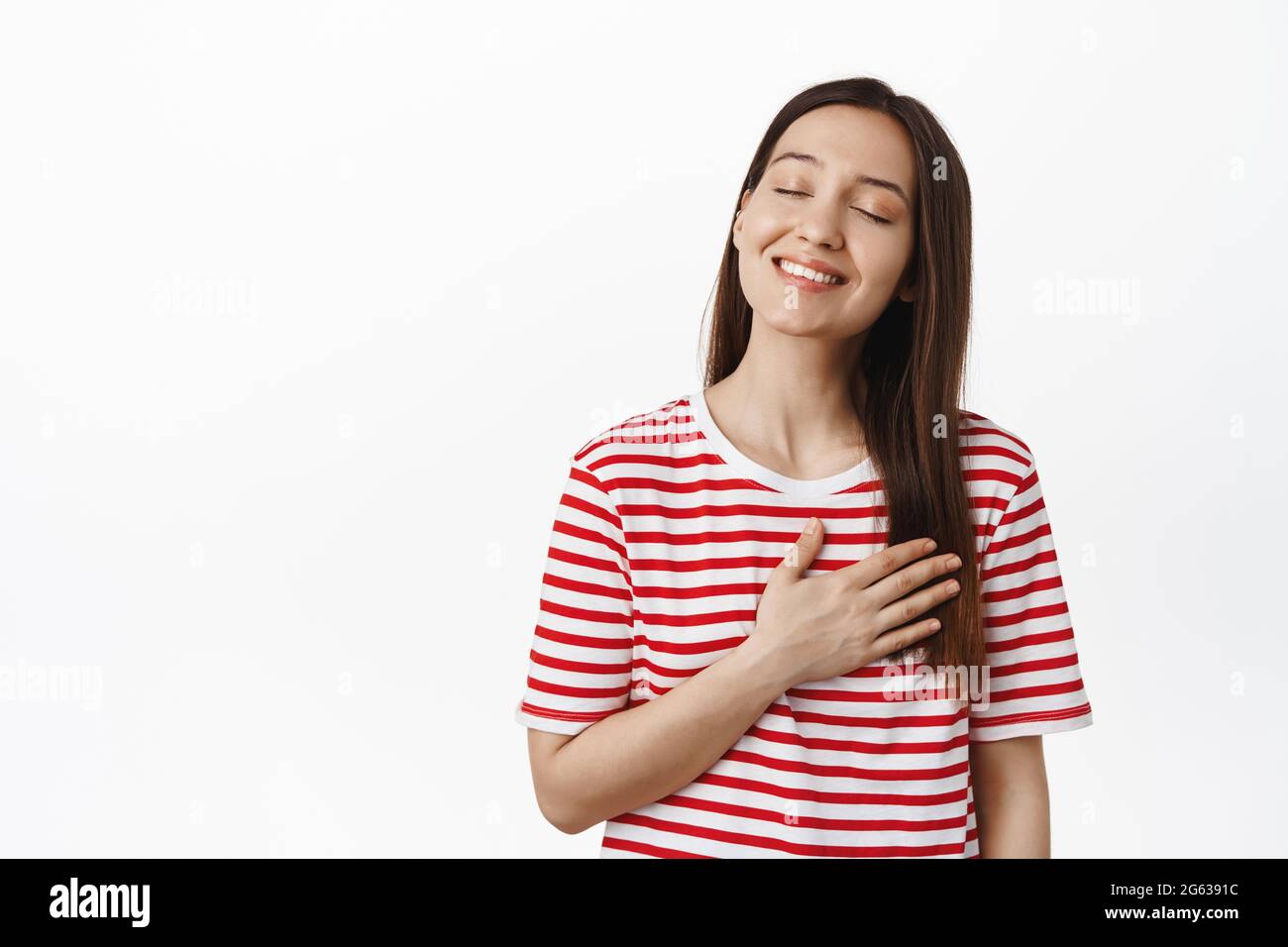 Image of dreamy smiling brunette girl, thinking of smth romantic, close ...