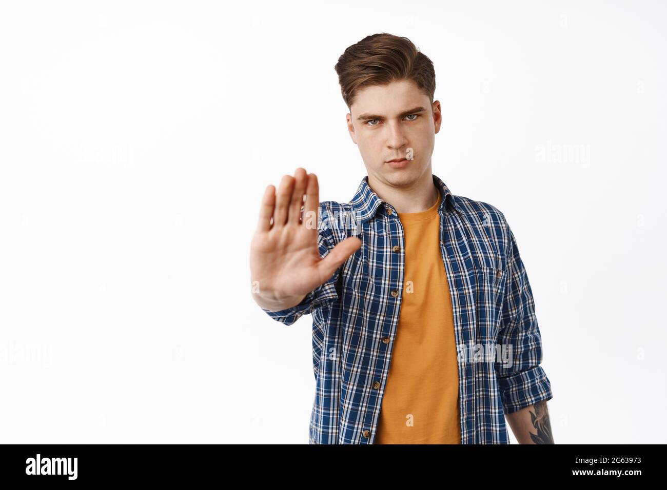 Stop. Serious and confident man restrain, say back off, no gesture ...