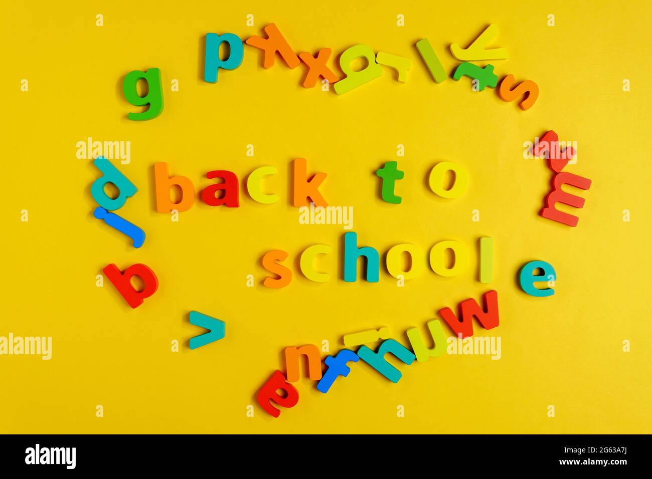 Stop motion. Back to school. Colorful inscription on the yellow. Funny ...