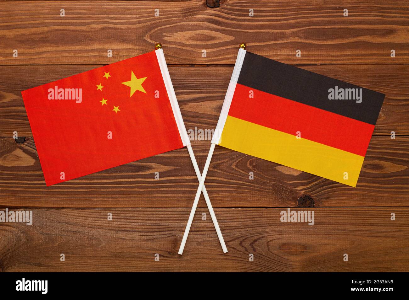 Flag of China and flag of Germany crossed with each other. The image ...
