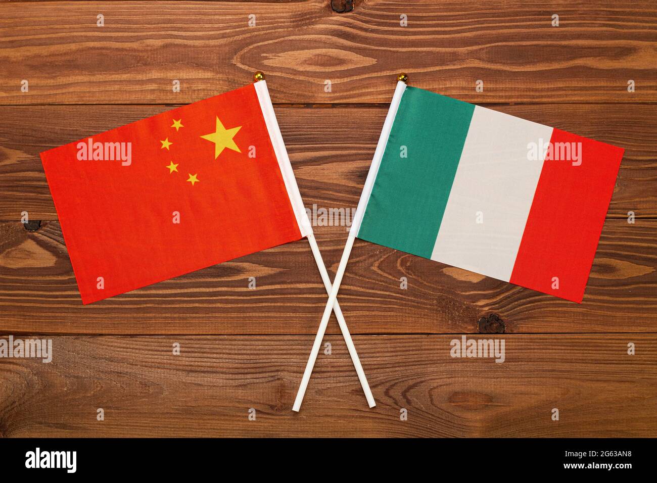 Flag of China and flag of Italy crossed with each other. The image ...