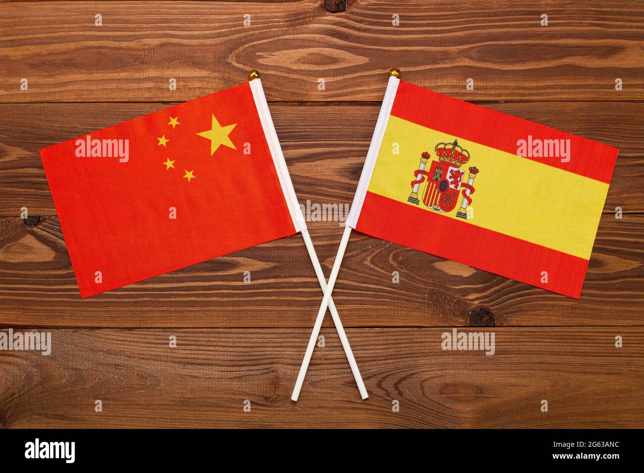 Flag of China and flag of Spain crossed with each other. The image ...