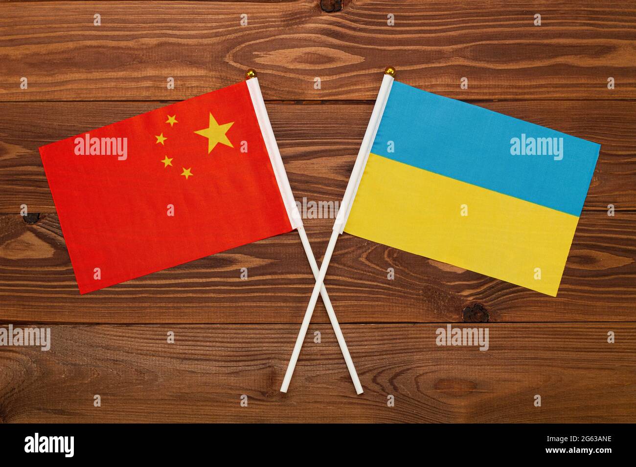 Flag of China and flag of Ukraine crossed with each other. The image ...