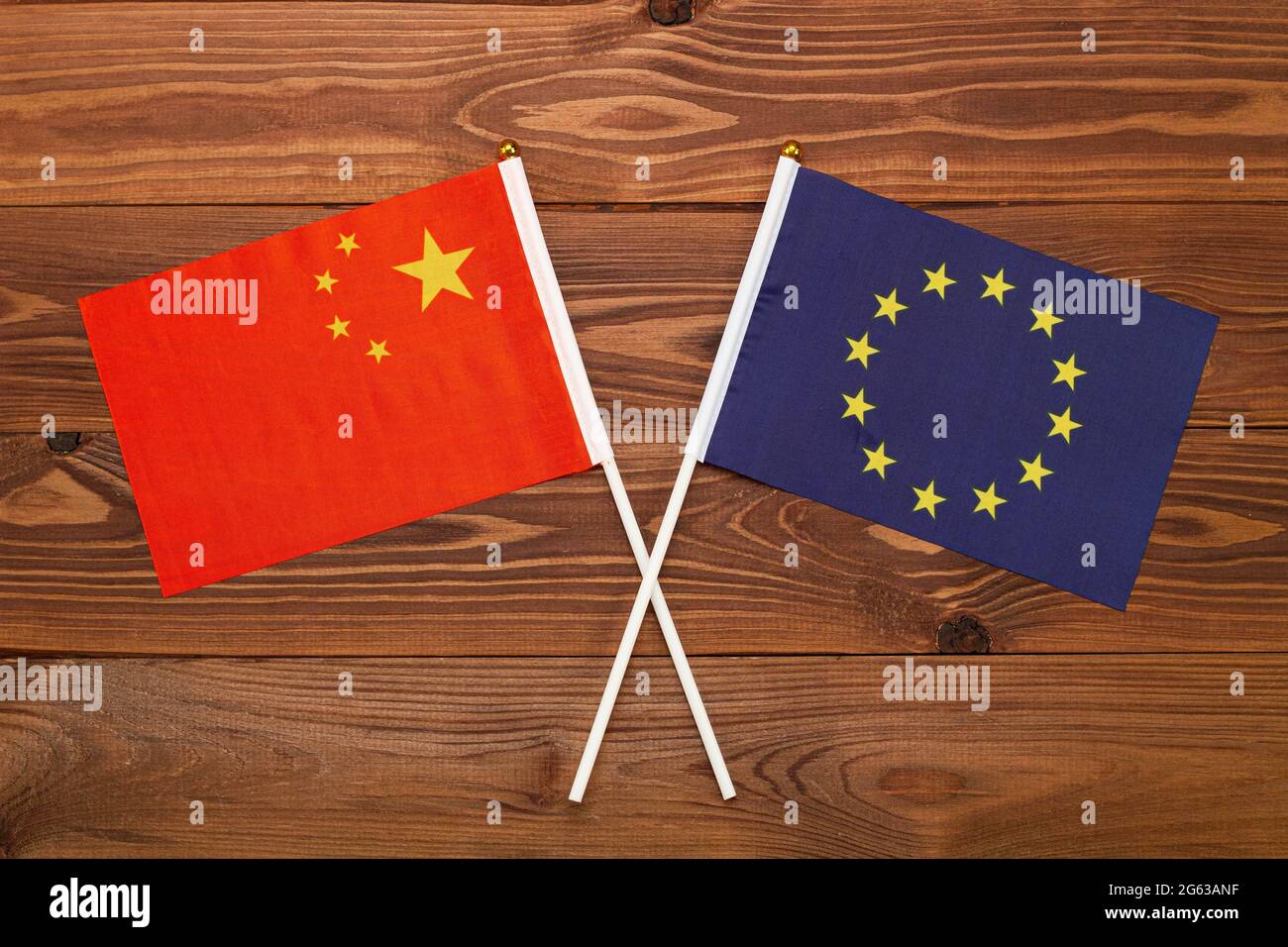Flag of China and flag of European Union crossed with each other. The ...