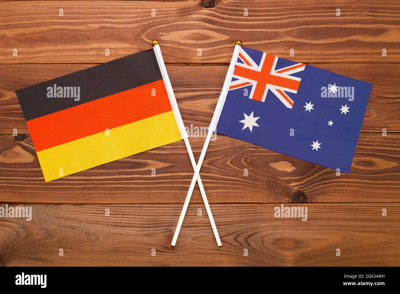 Flag of Germany and flag of Australia crossed with each other. The ...