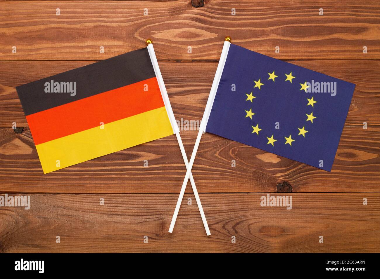 Flag of Germany and flag of European Union crossed with each other. The ...