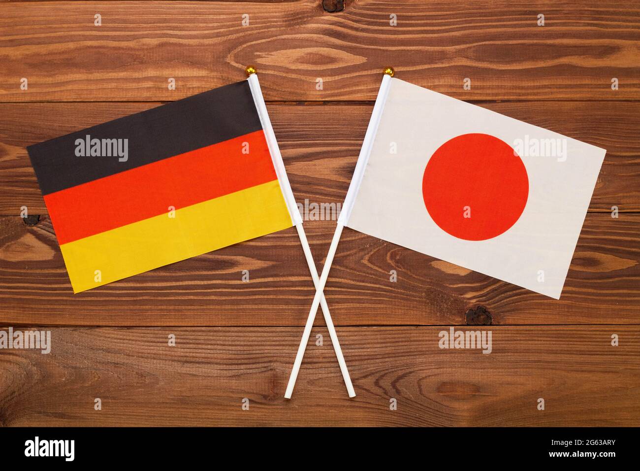 Flag of Germany and flag of Japan crossed with each other. The image ...