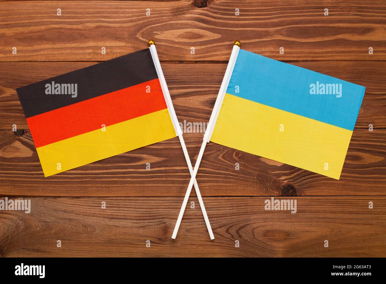 Flag of Germany and flag of Ukraine crossed with each other. The image ...