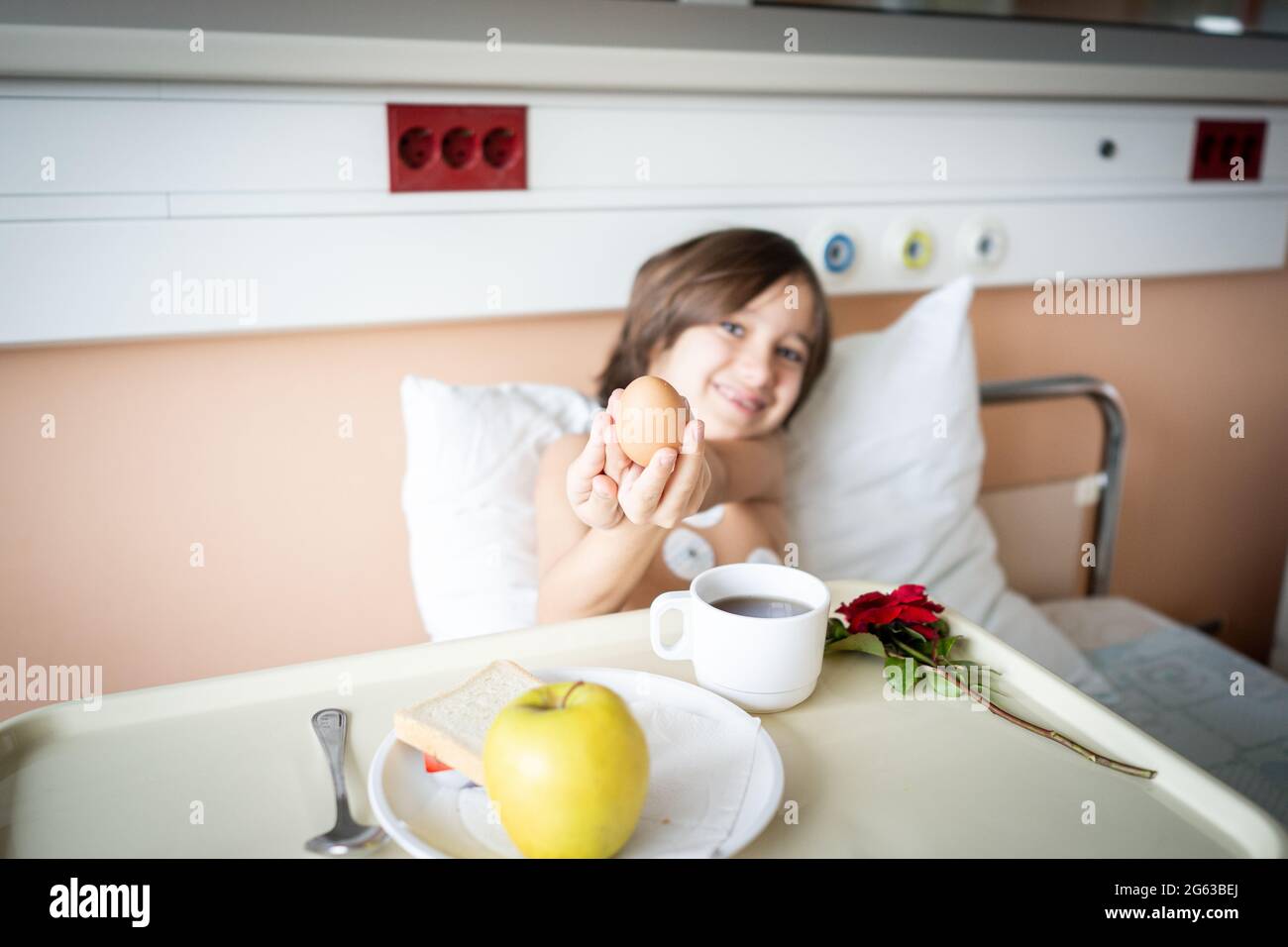 Little cute boy in hospital at bed indoors Stock Photo - Alamy