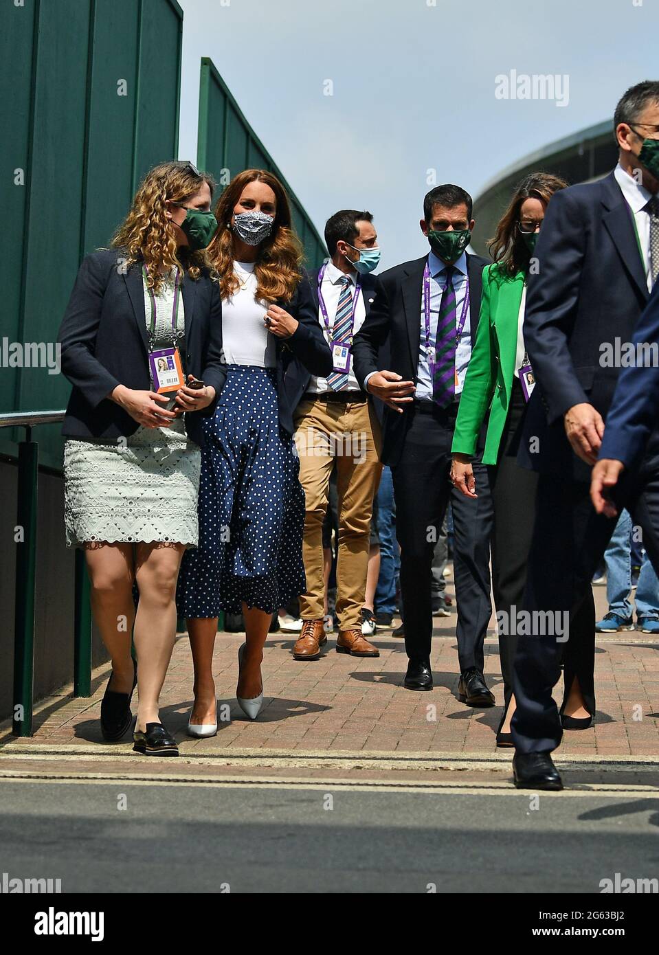 The Duchess of Cambridge (second left) walks with Tim Henman (centre ...