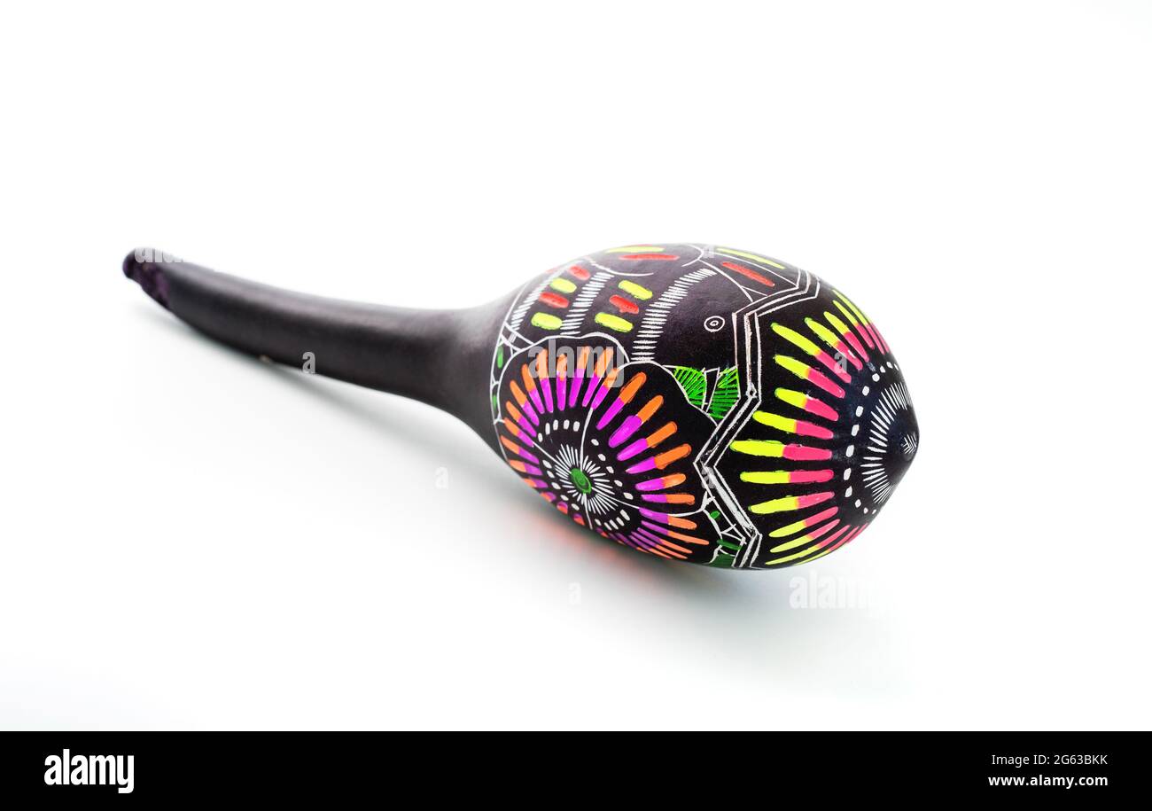 Painted maracas lying on white background Stock Photo - Alamy