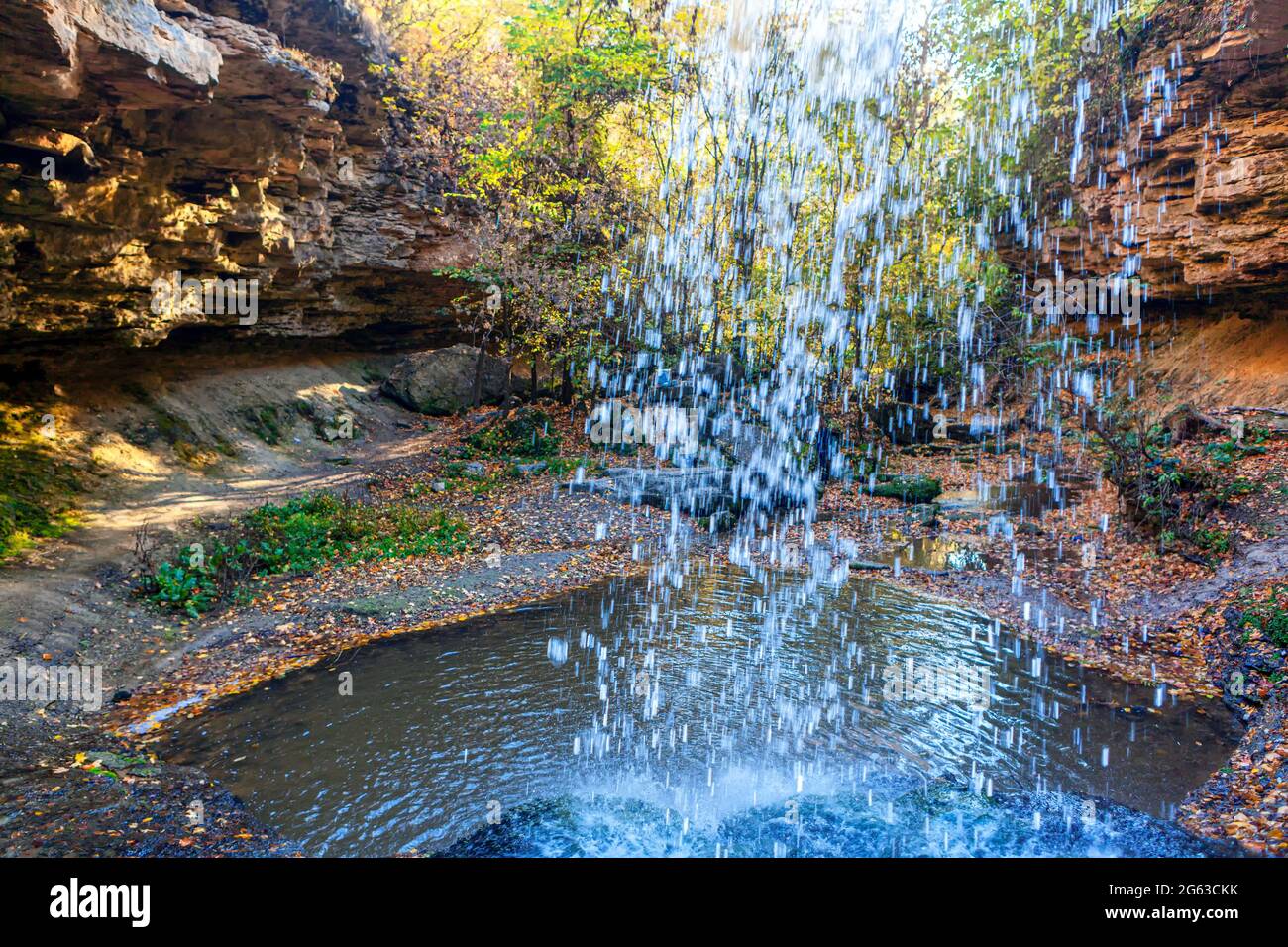 Water splashing of natural waterfall . Falling water drops in nature ...