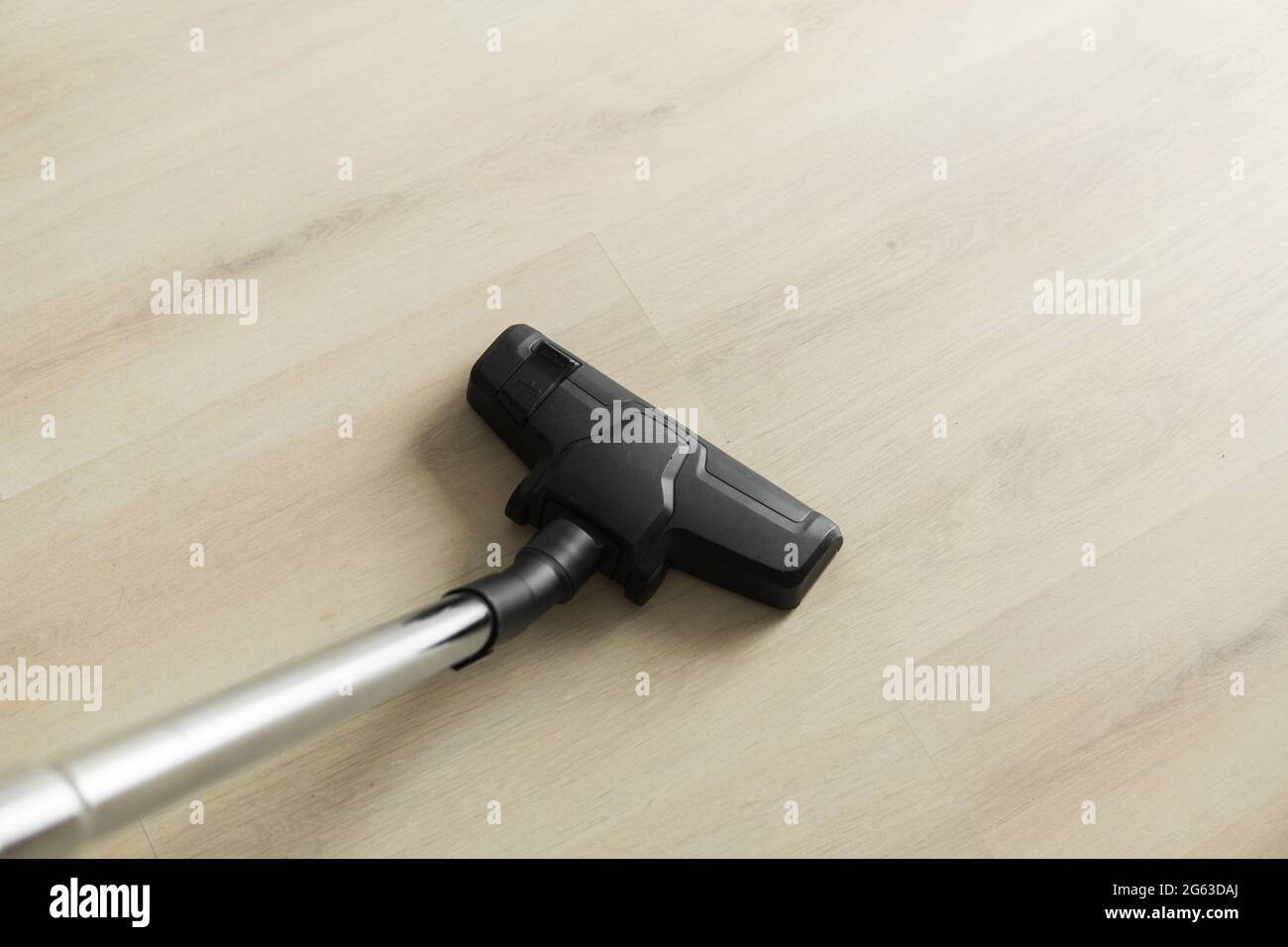 Top view of head of modern vacuum cleaner cleaning a laminate Stock ...