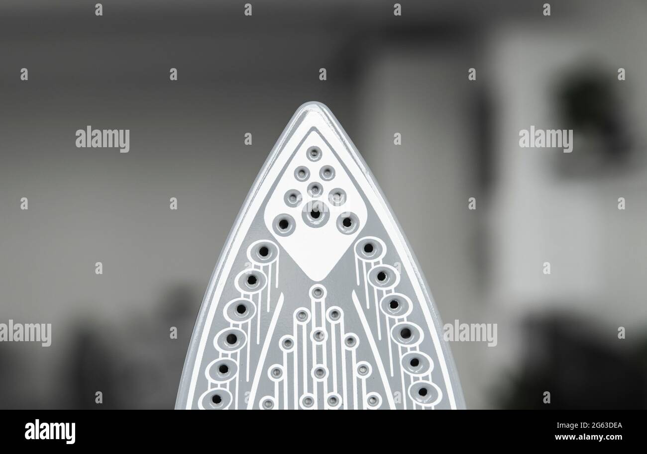 Bottom surface of the Iron with a holes Stock Photo - Alamy