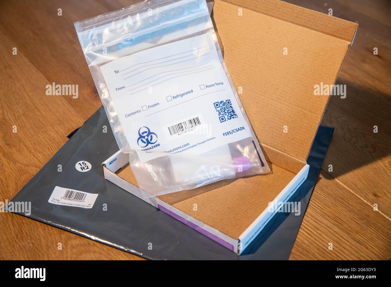 Completed NHS-issued covid PCR home test ready to be sent back to the ...