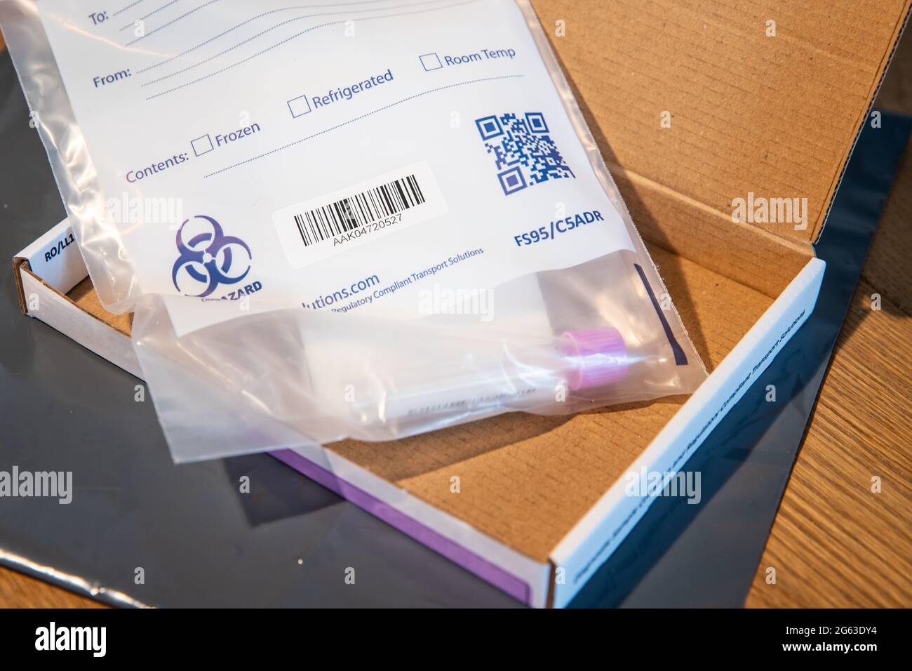Completed NHS-issued covid PCR home test ready to be sent back to the ...