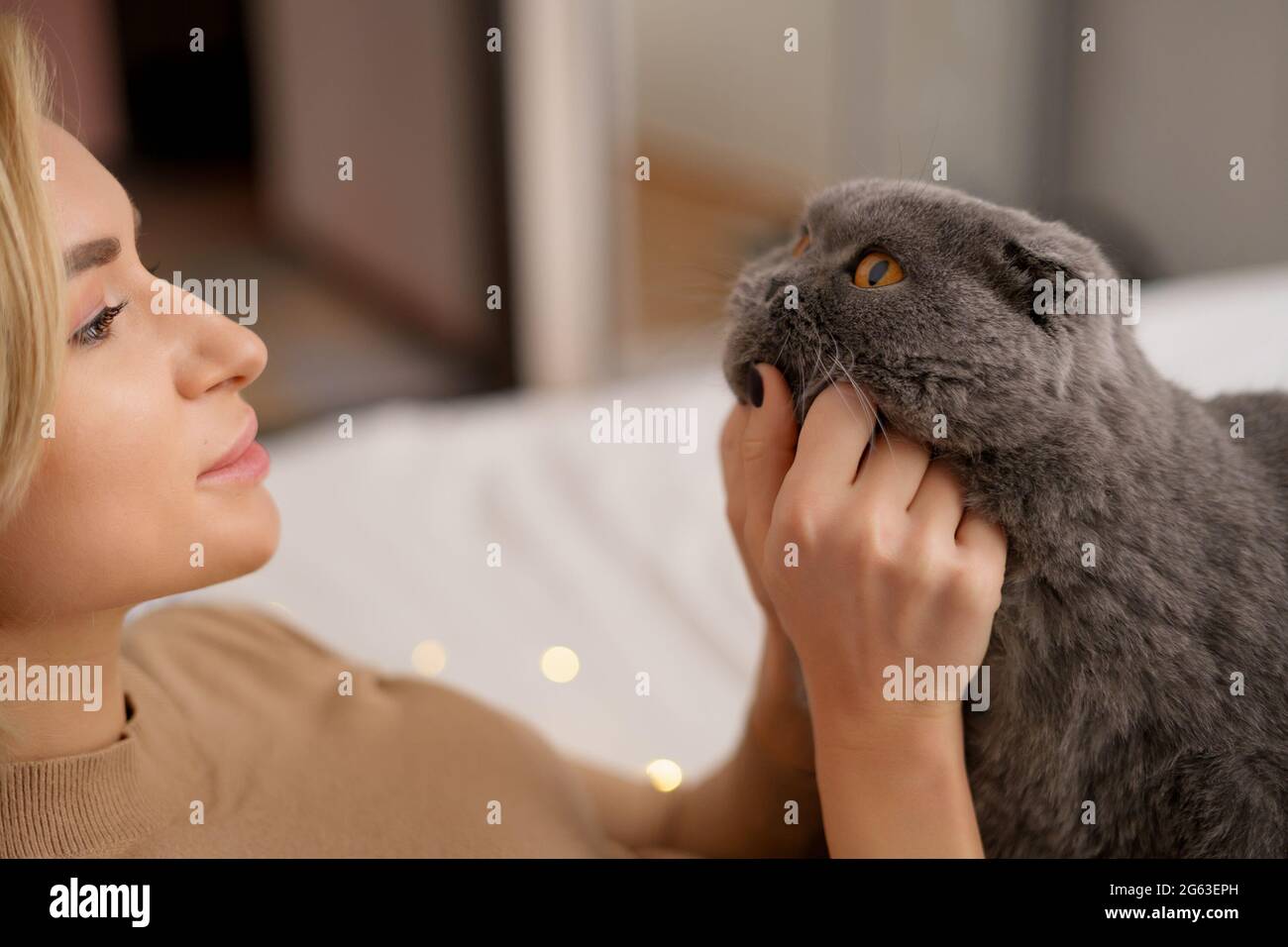 Pets, morning, comfort, rest and people concept - happy young woman ...