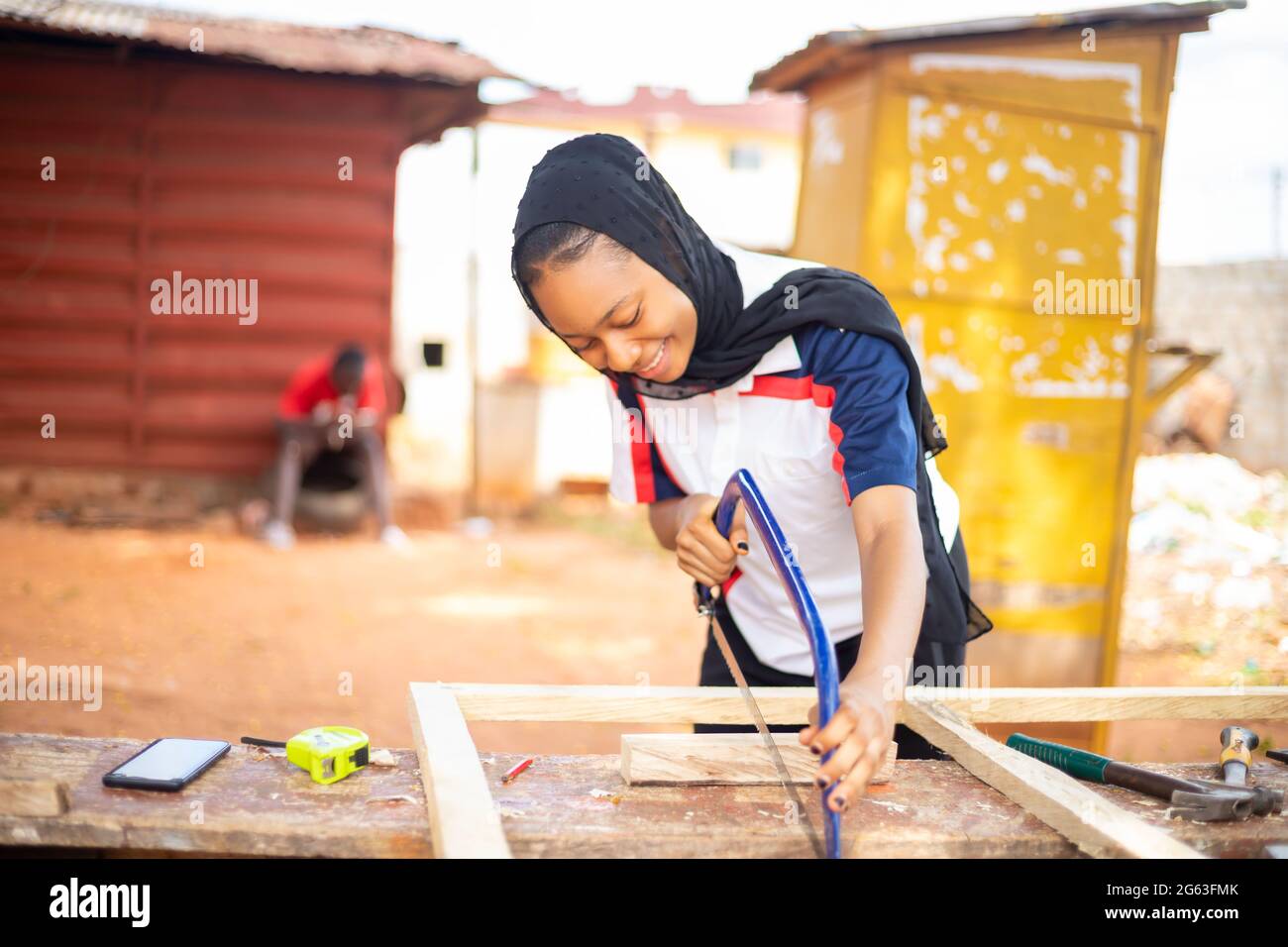 local African carpenter at work smiling Stock Photo - Alamy