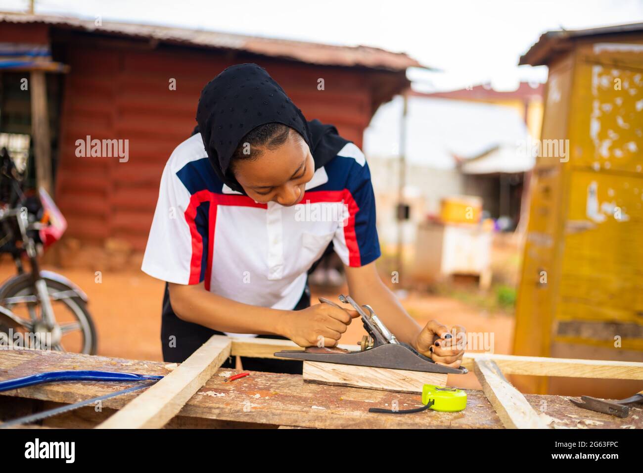 local African carpenter at work smiling Stock Photo - Alamy