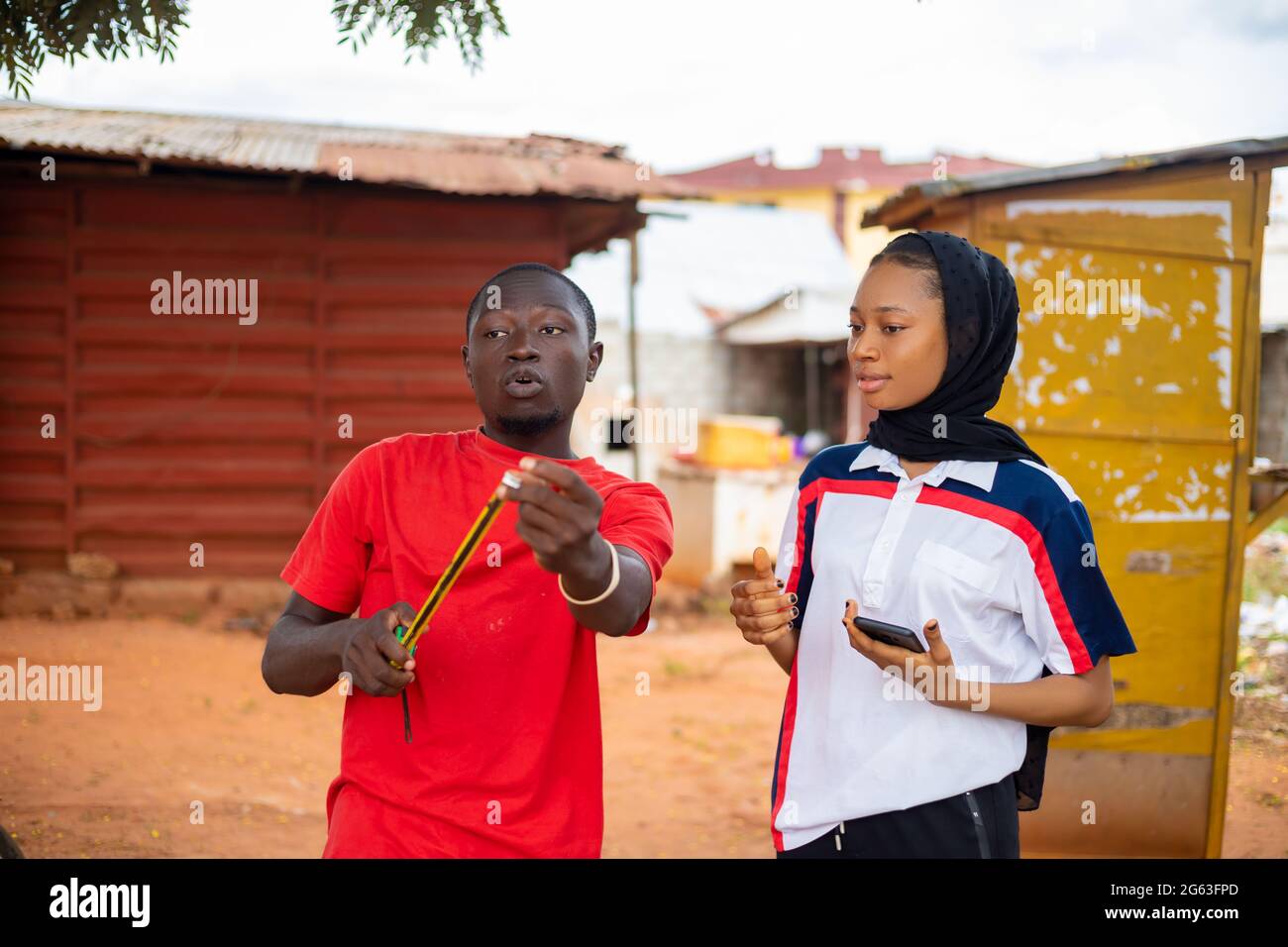local african carpenter at work explaining to his client Stock Photo ...