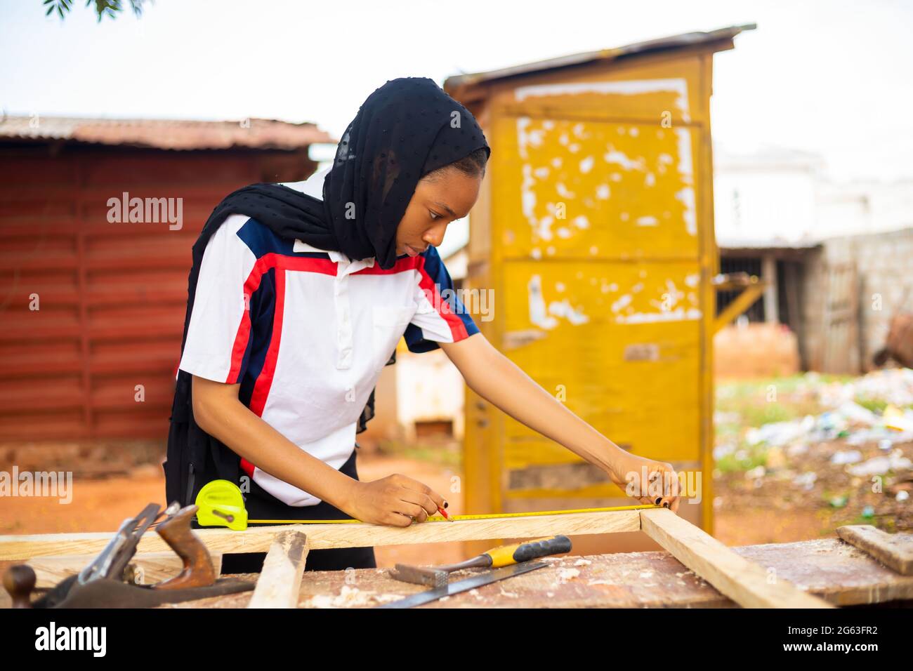 Carpenter holding tools african hi-res stock photography and images - Alamy