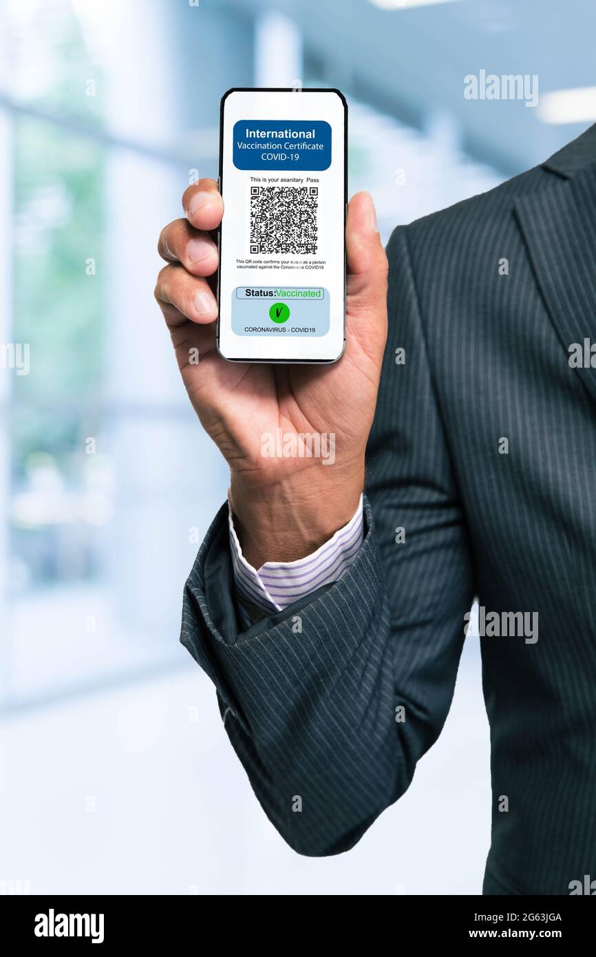 Man showing us his health pass with the validation of the vaccination ...