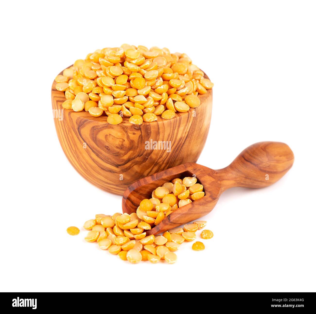 Dry yellow split peas in olive bowl and scoop, isolated on white ...