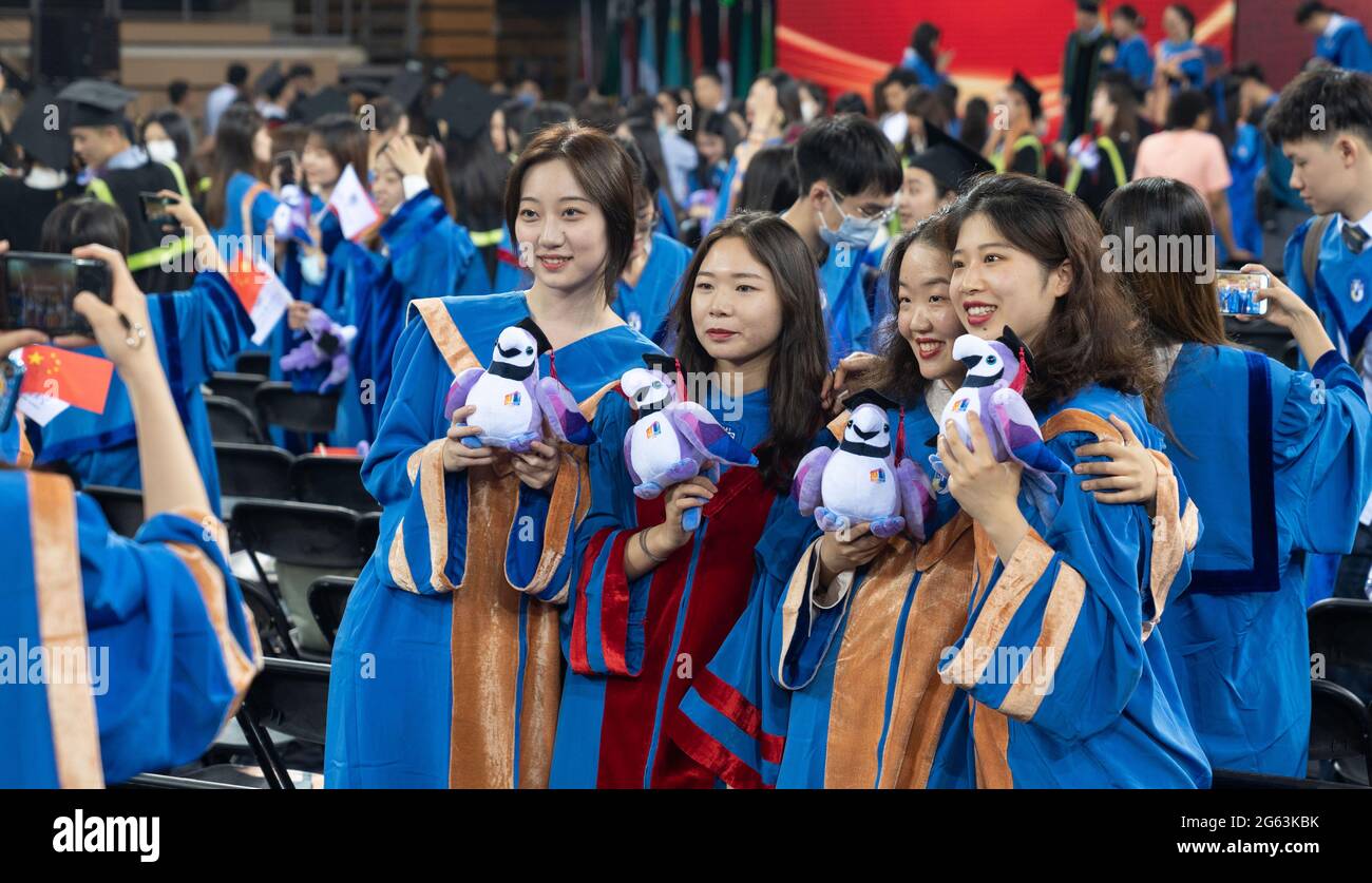 Beijing, China. 2nd July, 2021. Graduates take group photos during a ...