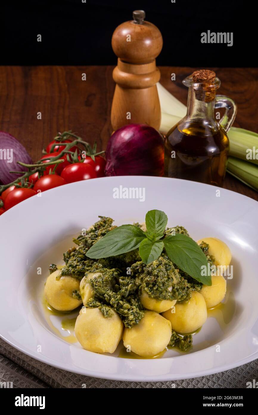 Potato gnocchi with pesto sauce Stock Photo - Alamy