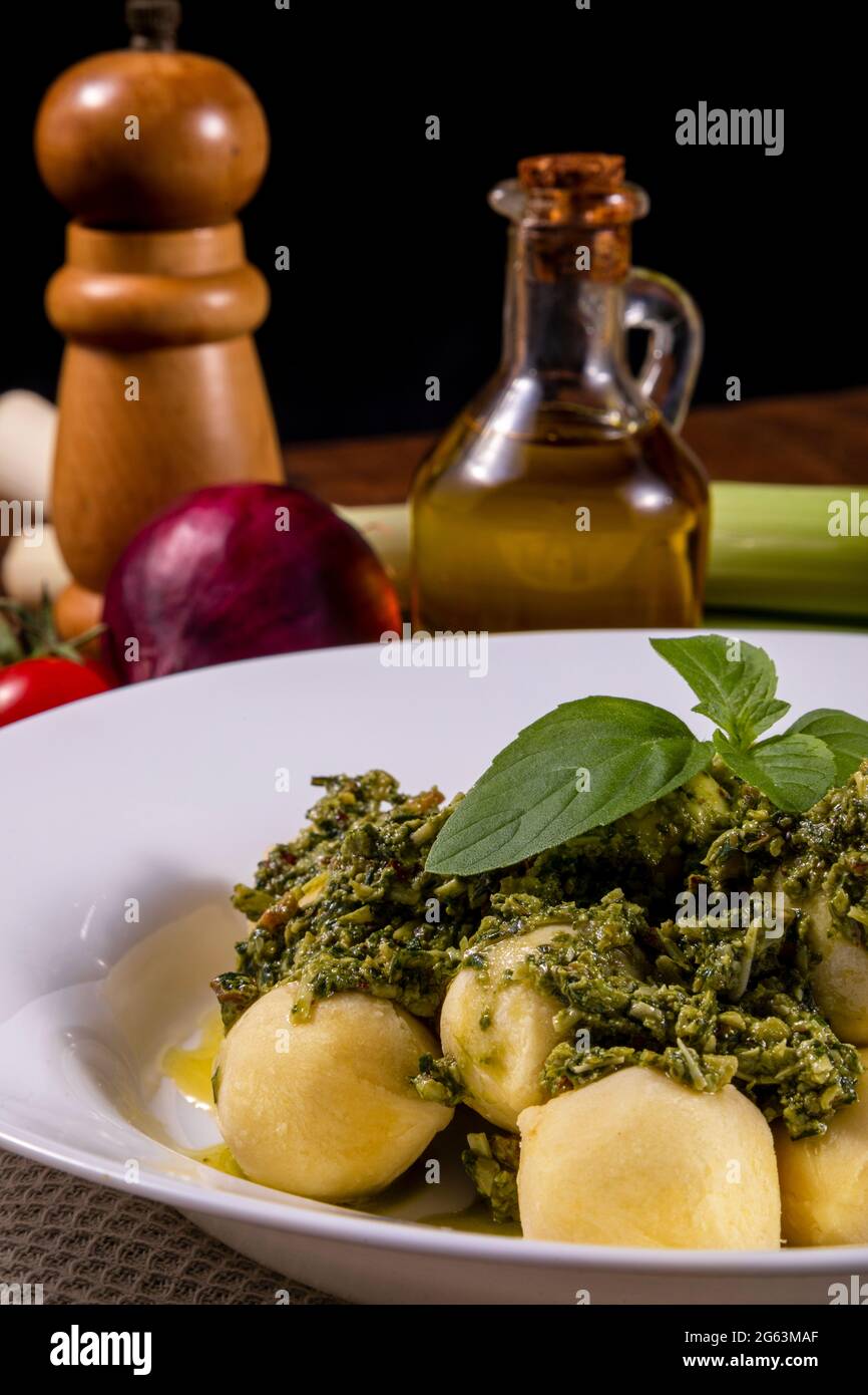 Potato gnocchi with pesto sauce Stock Photo - Alamy