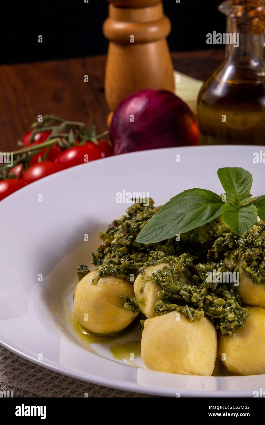 Potato gnocchi with pesto sauce Stock Photo - Alamy