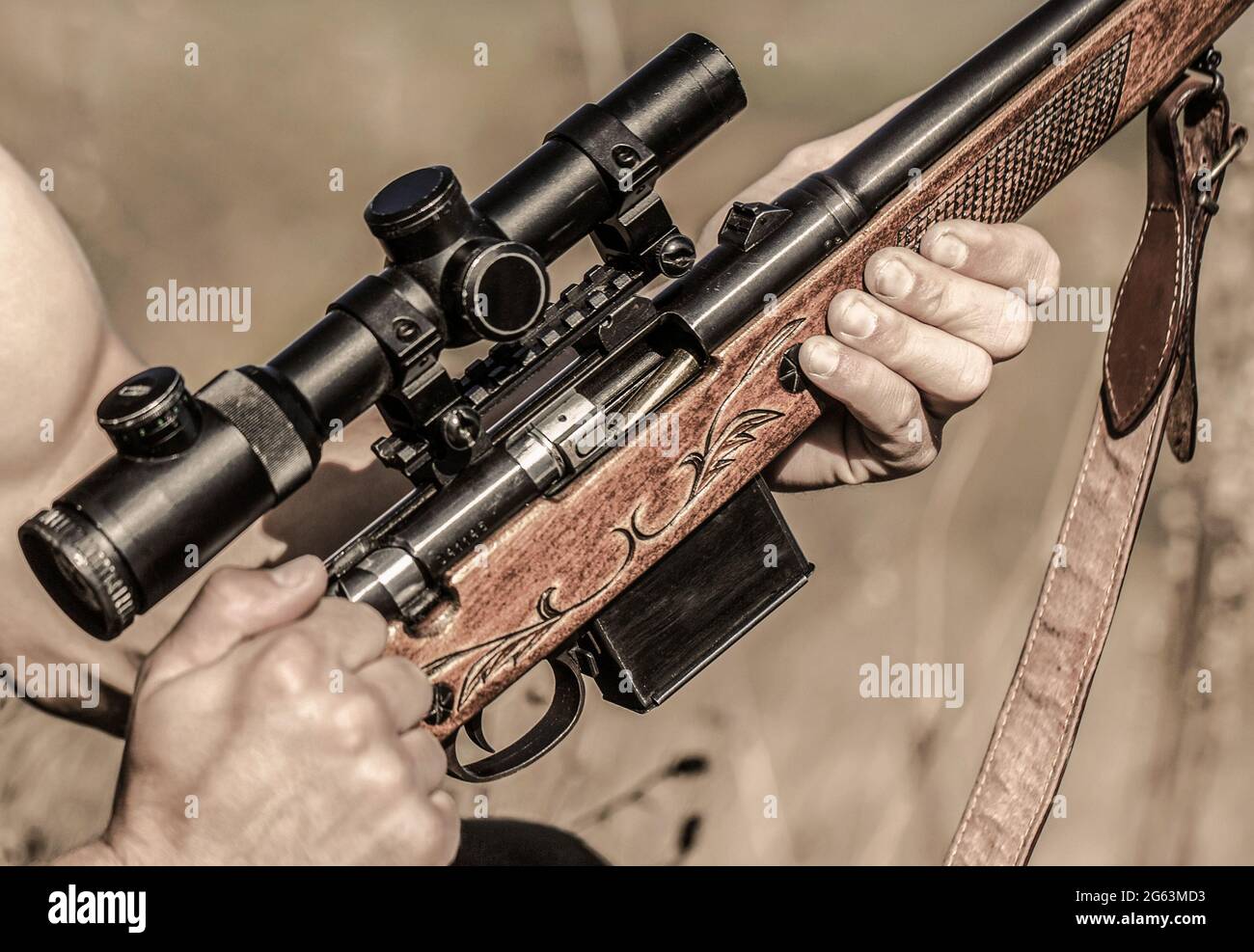 Man is charging a hunting rifle. Process of hunting during hunting ...