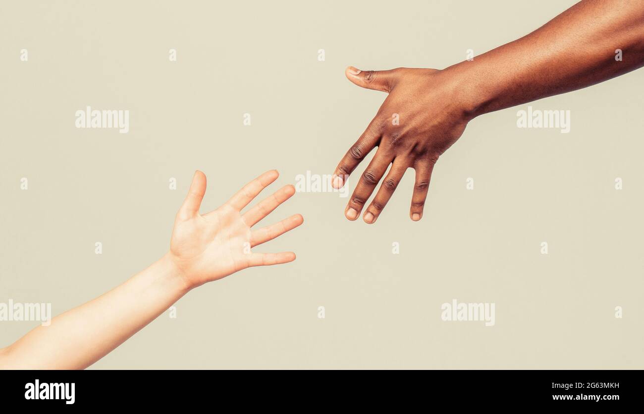 Rescue gesture. Black and white human hands. African and caucasian ...