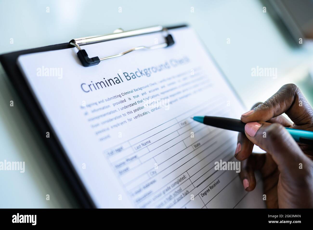 Hand Filling Criminal Background Check Application Form Stock Photo - Alamy