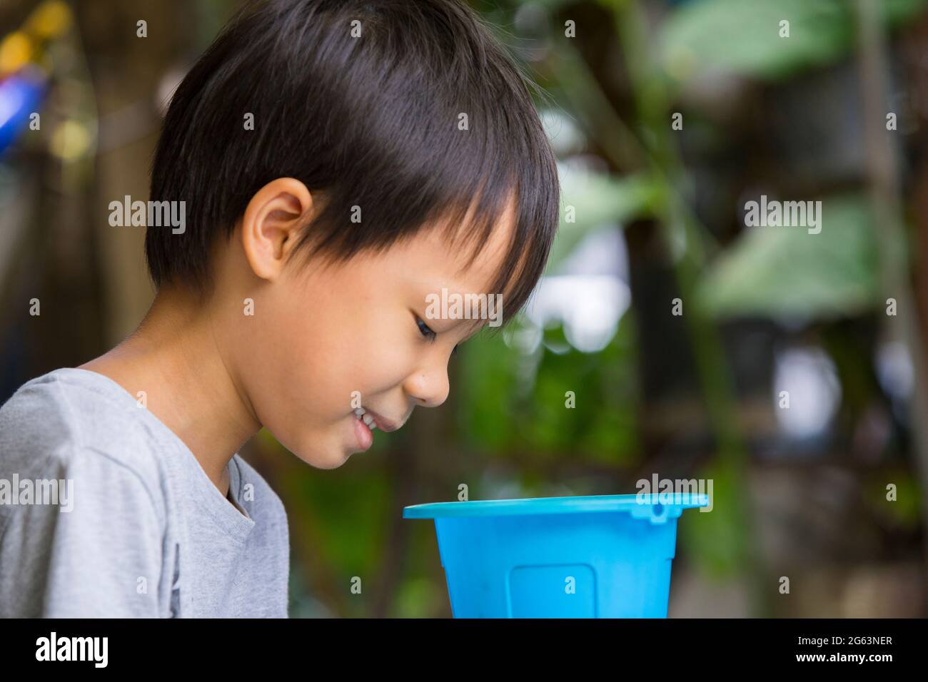 Boy plant pot hi-res stock photography and images - Alamy