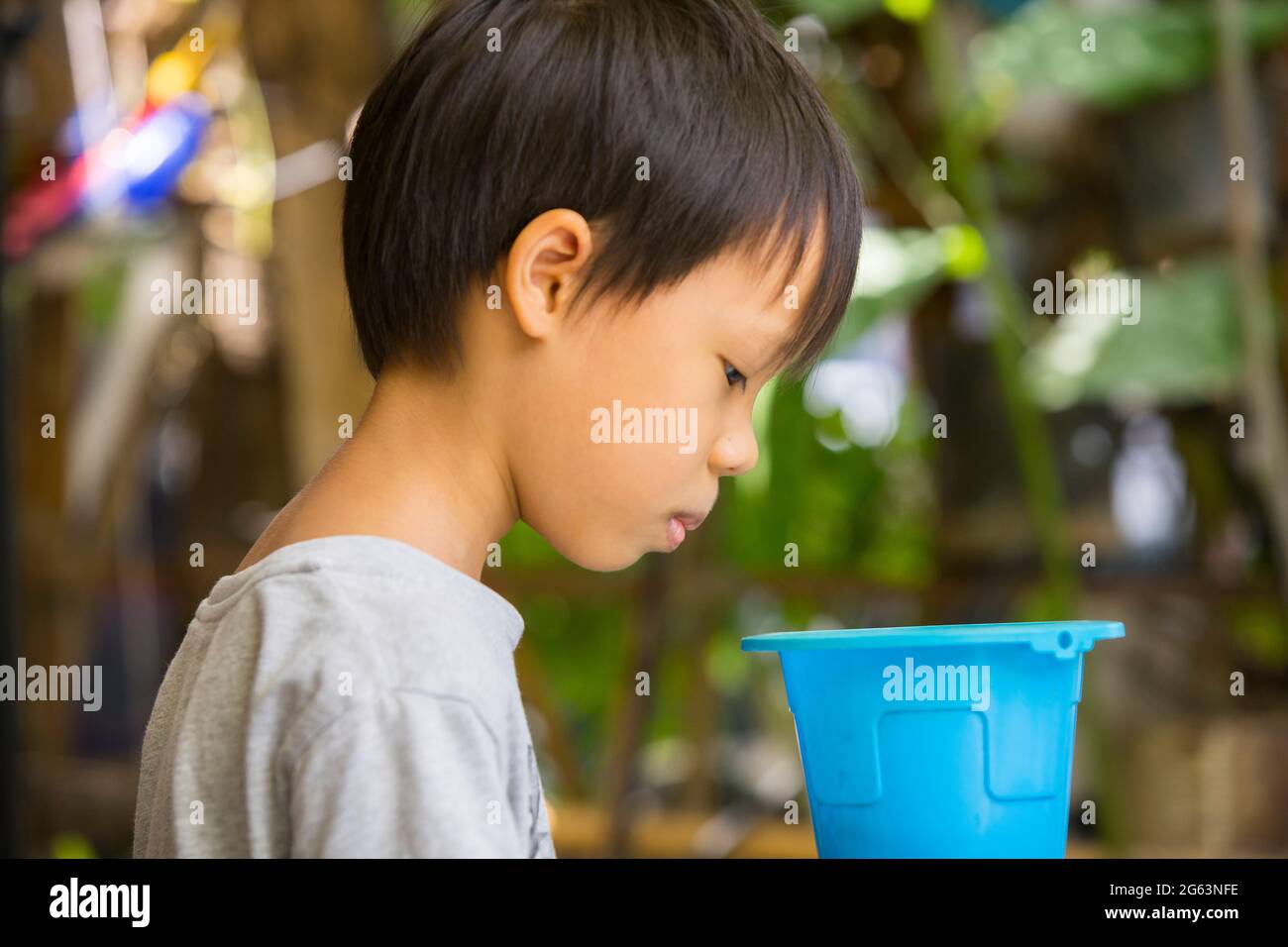 Boy plant pot hi-res stock photography and images - Alamy