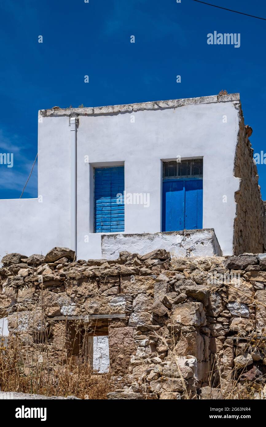 Cyclades Greece. Small white house with blue color door and window ...