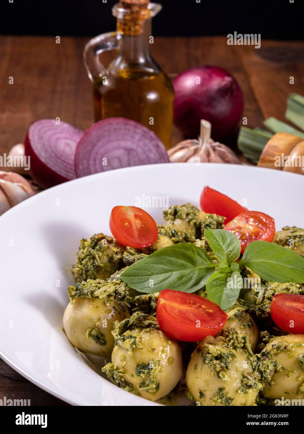 Potato gnocchi with pesto sauce Stock Photo - Alamy
