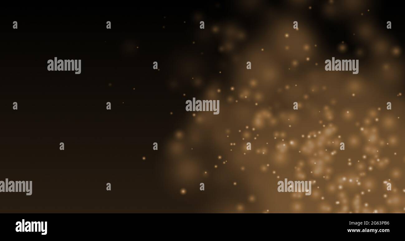 Glowing brown particles effervescing on a dark background Stock Photo ...
