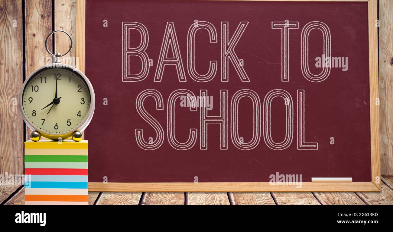 Composition of back to school text and alarm clock Stock Photo - Alamy