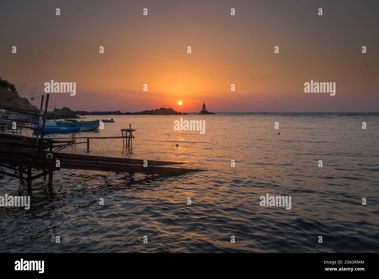Ahtopol - September 10: Sunrise at the beach with fishing pier, rocks ...