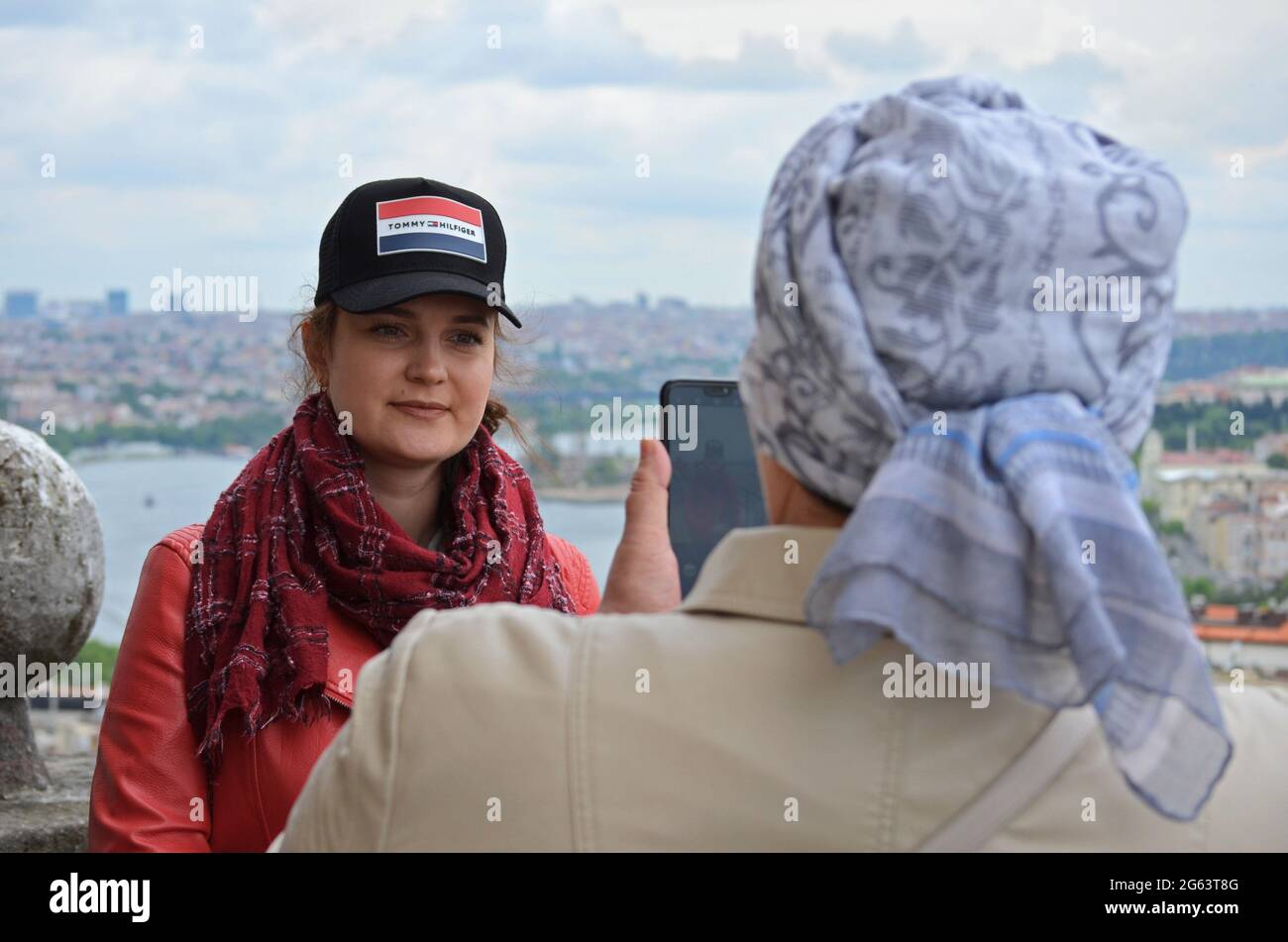 Two Dutch tourists taking momento photos by cell phone from the top of ...