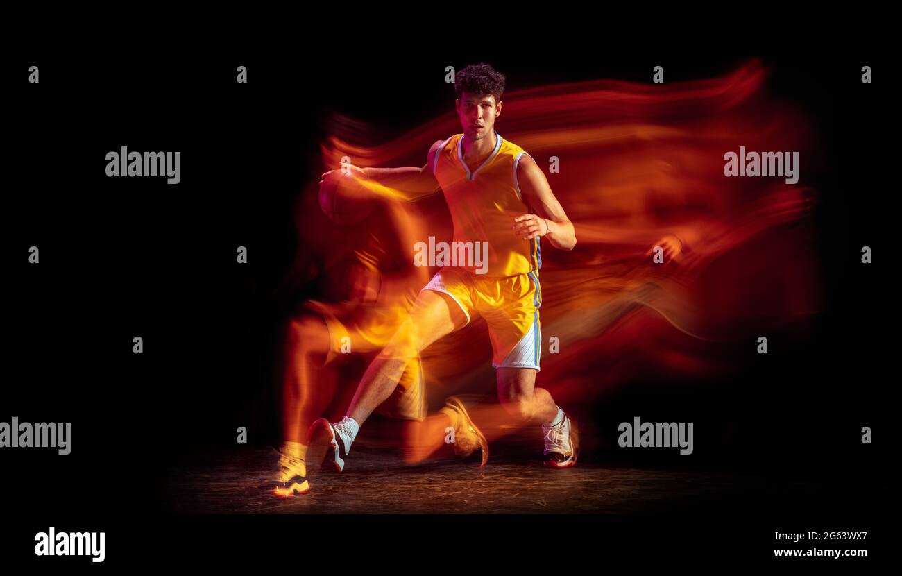 Young Caucasian professional basketball player exercising isolated on ...