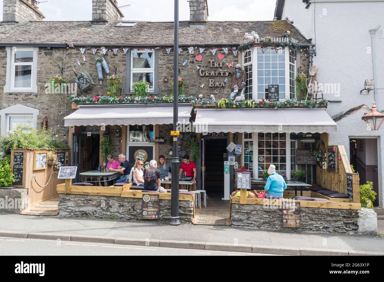 Cumbria, UK. 2nd July, 2021. UK The Crafty Baa pub in Windermere has ...