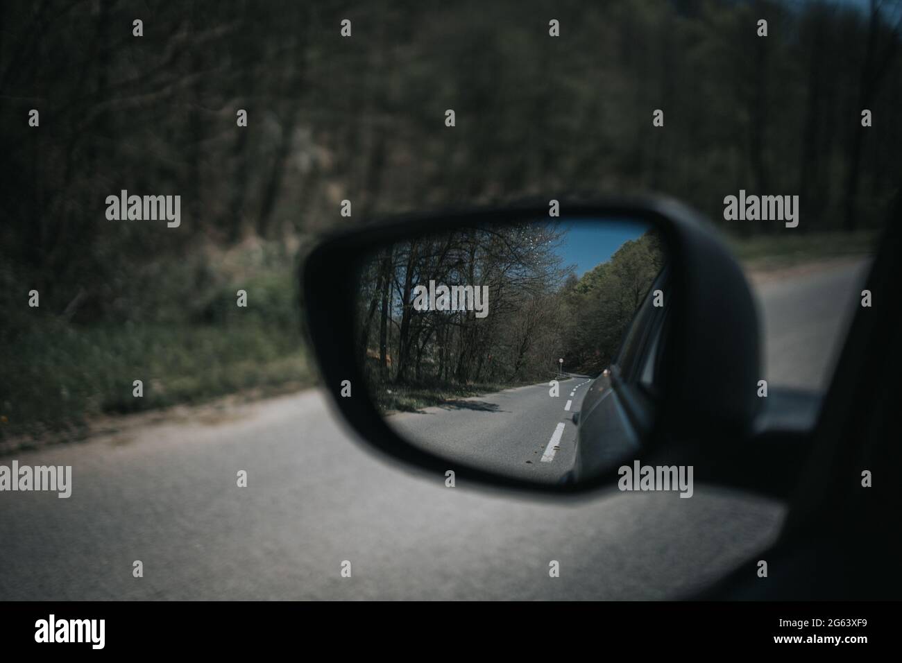 Side mirror car with a reflection of an empty highway road Stock Photo ...