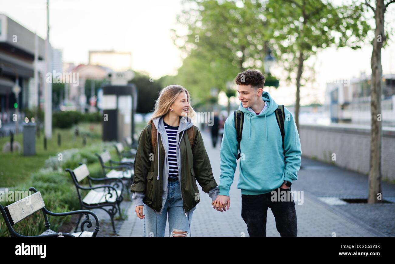 Young couple walking talking on hi-res stock photography and images - Alamy