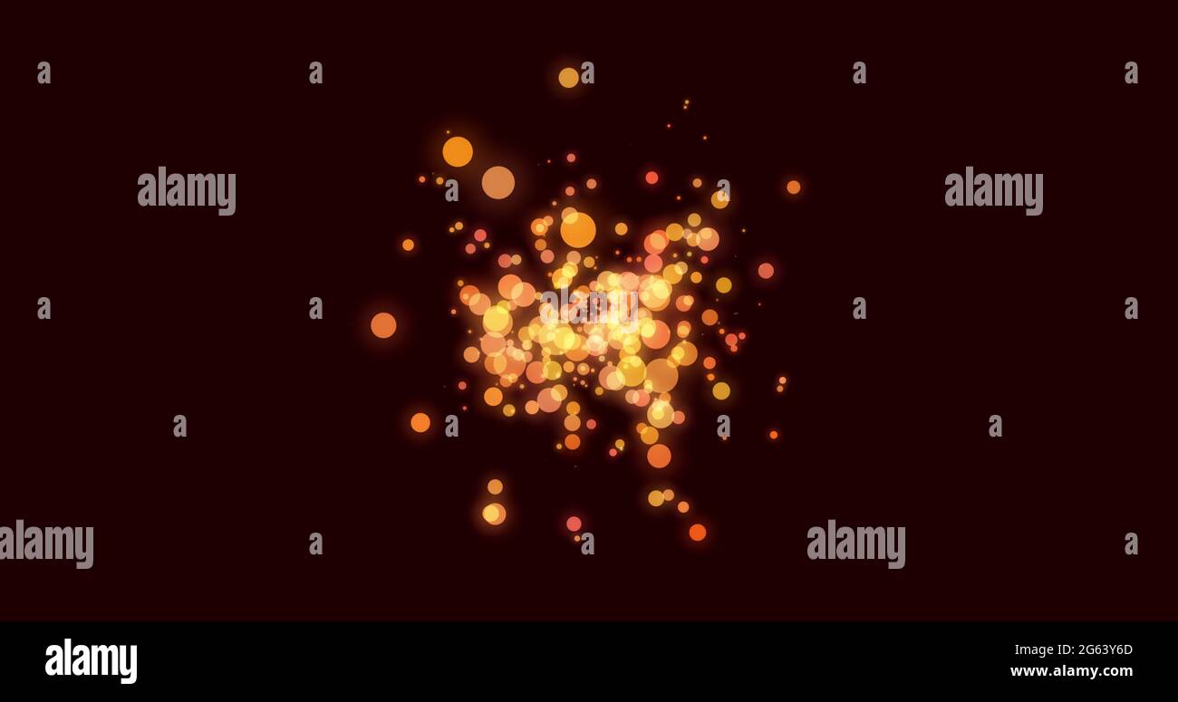 Orange and yellow glowing translucent circles effervescing on a dark ...