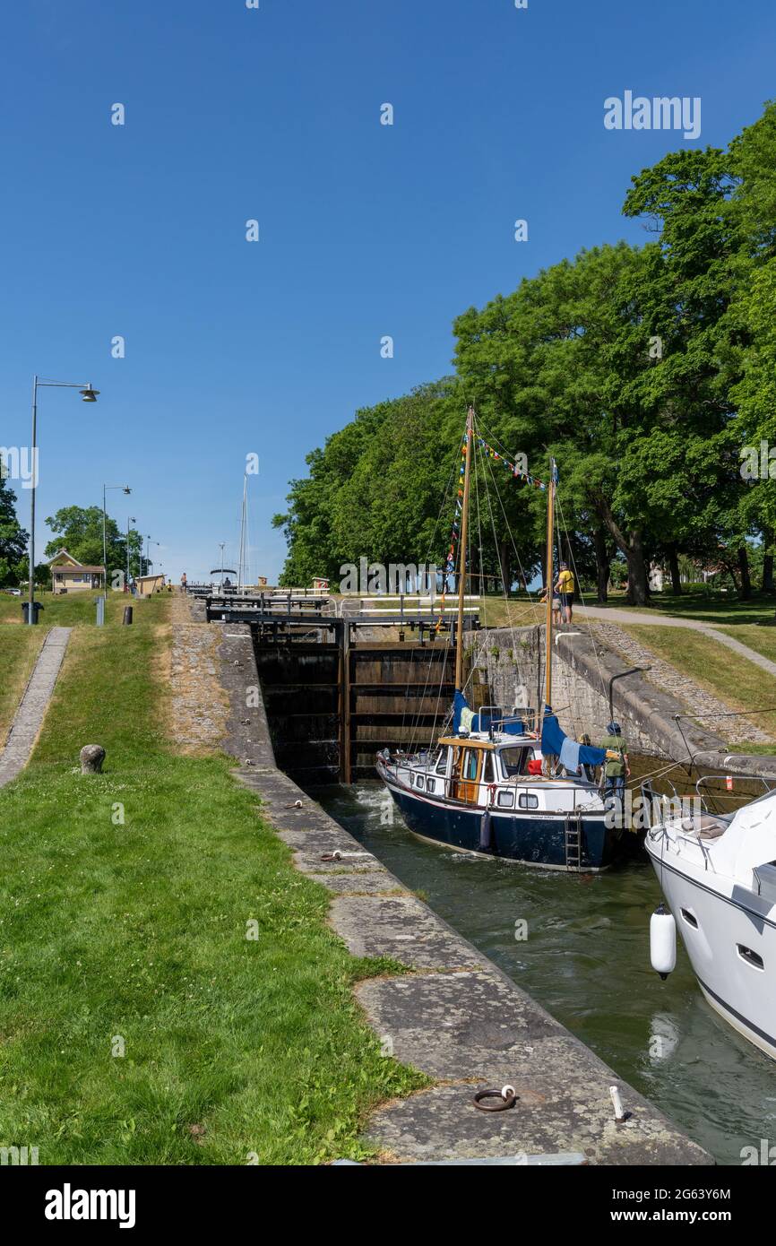 Berg, Sweden - 21 June, 2021: boats travelling upriver in the locks and ...